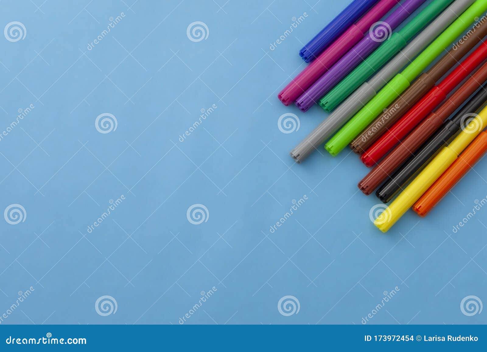 Color Pen on Blue Paper Background Stock Photo - Image of group, marker ...