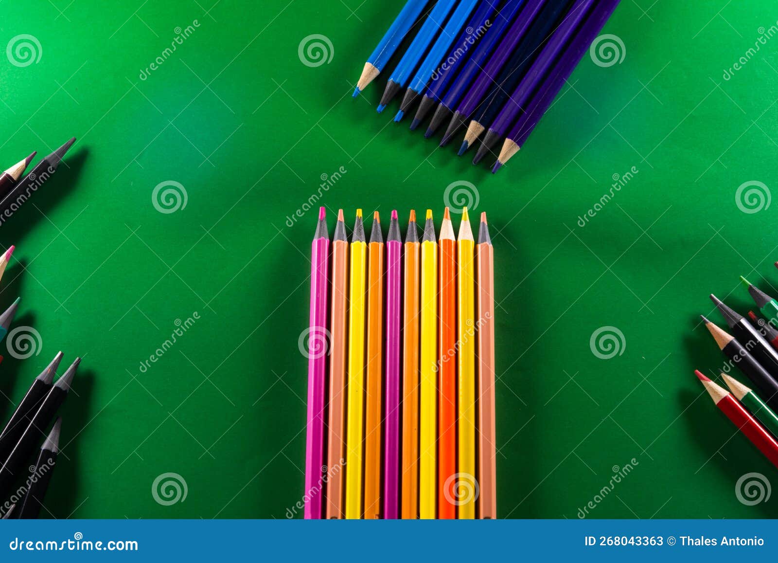 Color Pencils on Green Background. Stacked Side by Side Stock Image ...