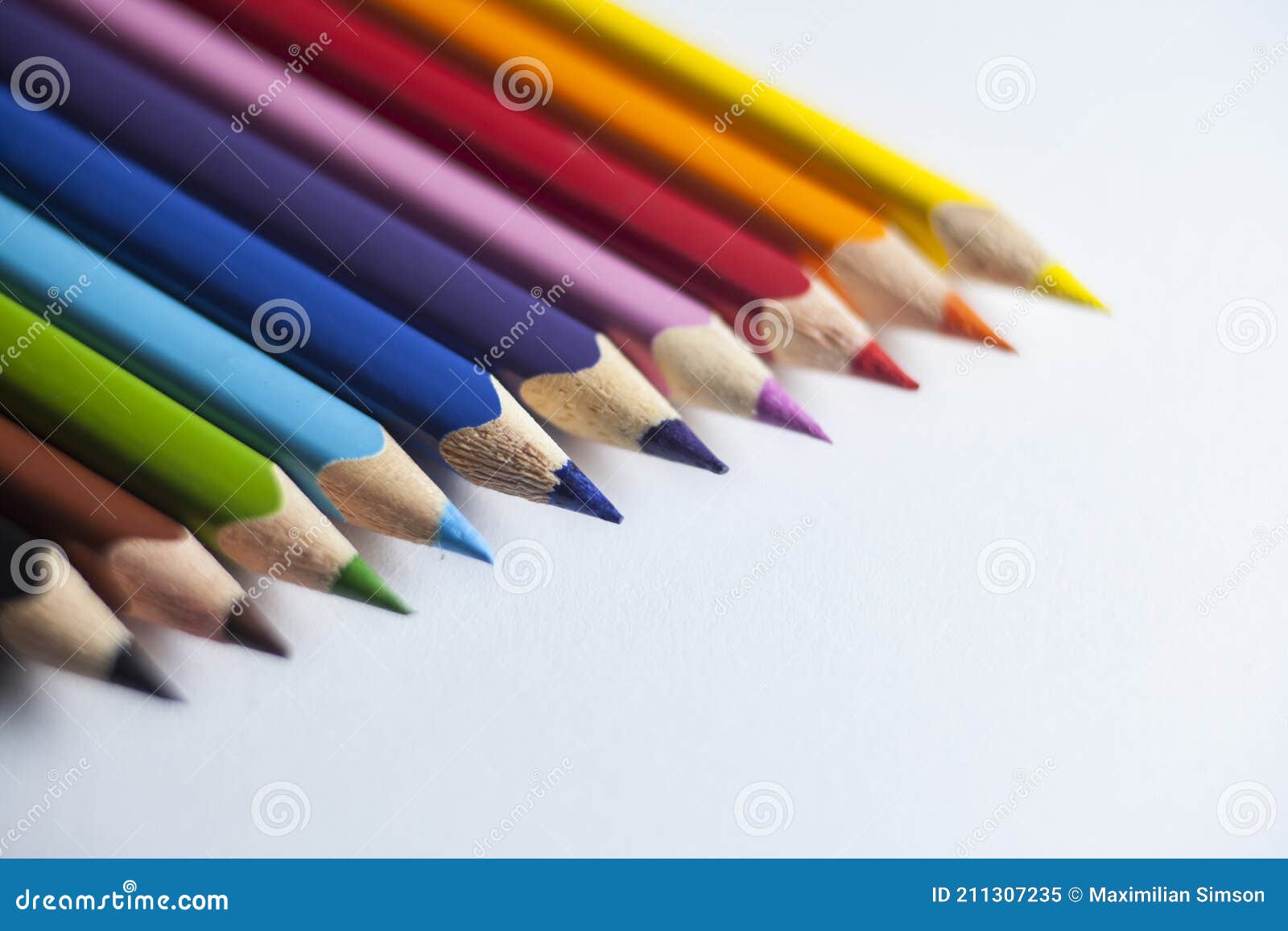Color Pencils on Sheet of Paper with Clean White Backdrop. Symbol for ...