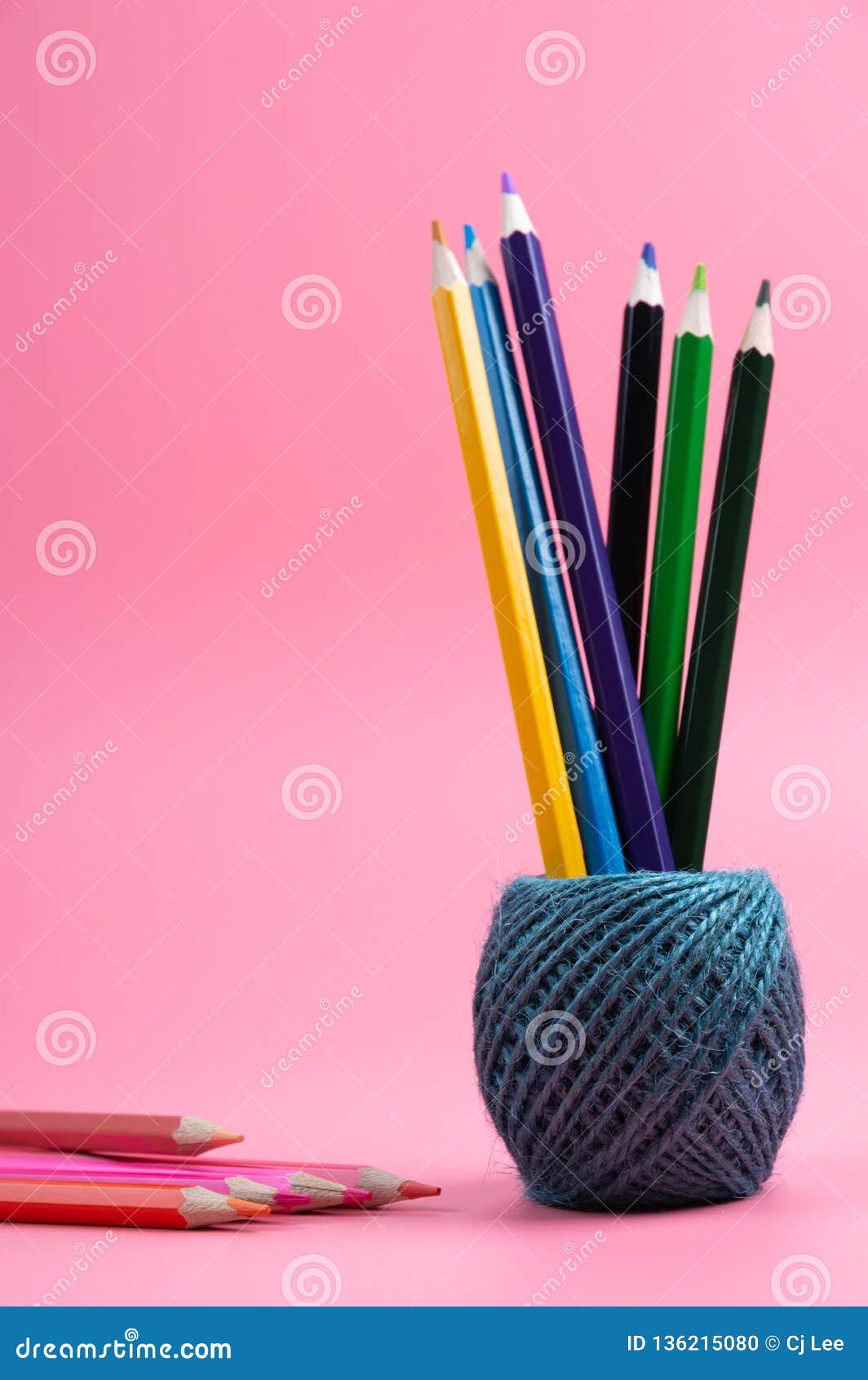 Color Pencils and String Basket on Red Background Stock Photo - Image ...