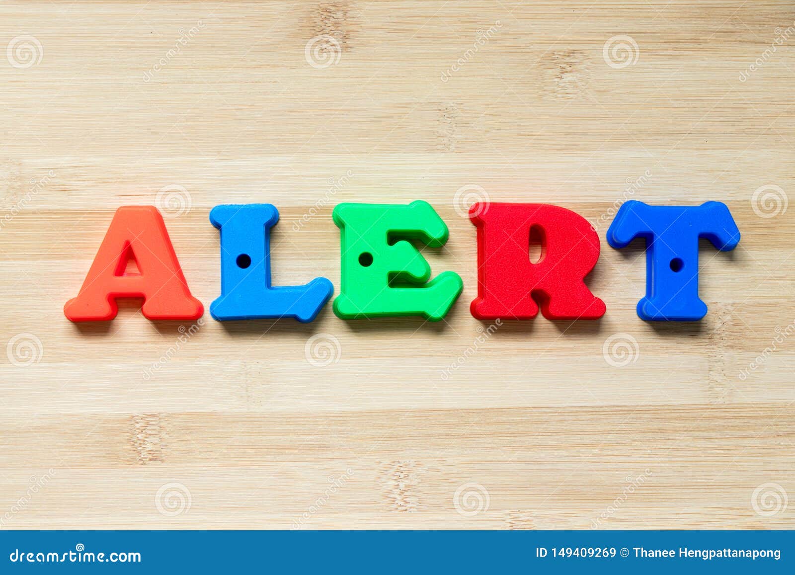 Color Alphabet in Word Alert on Wood Background Stock Image - Image of ...