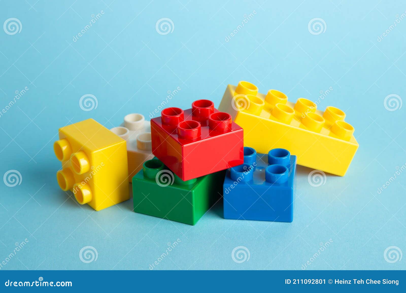 Color Plastic Building Blocks on Blue Background Editorial Photo ...