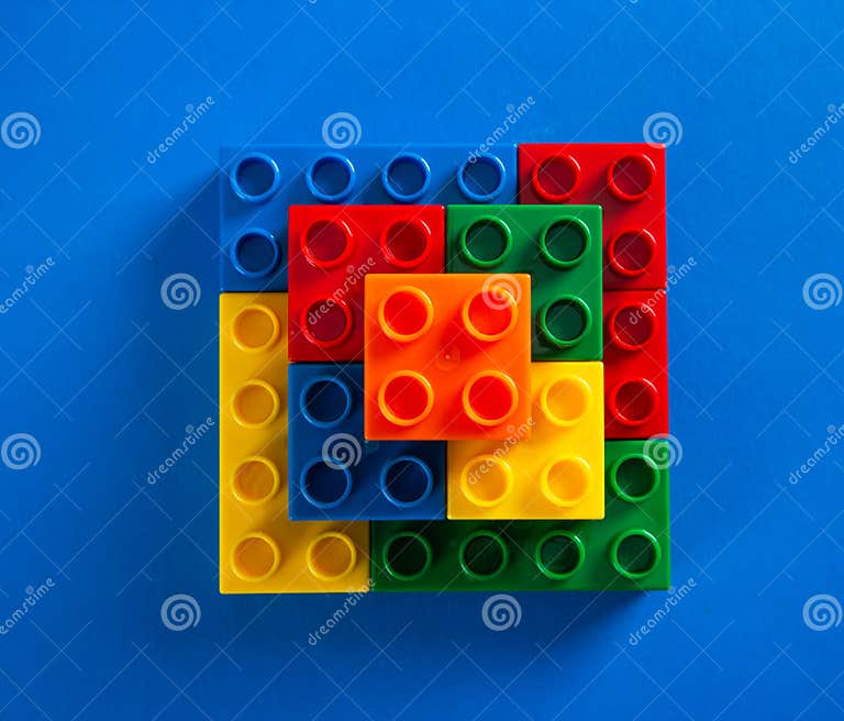 Color Plastic Building Blocks on Blue Background Stock Image - Image of ...
