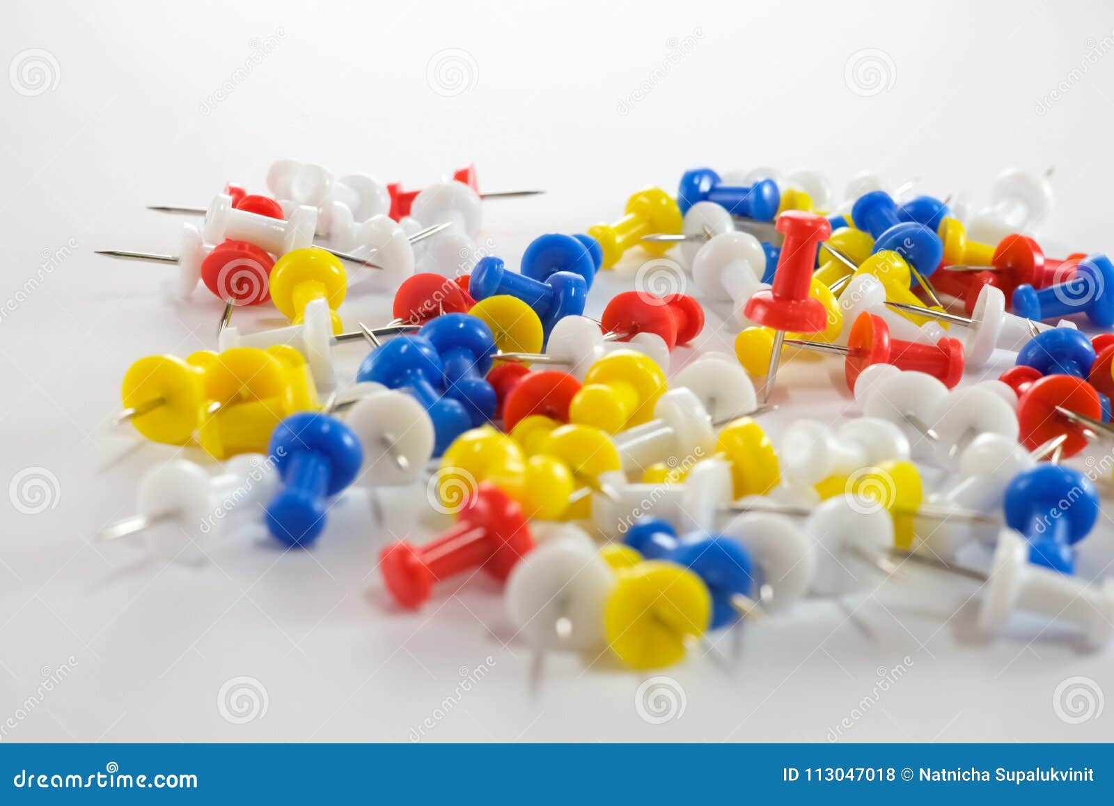 Color Push Pins Red, Yellow, White, and Blue Group on White Background ...