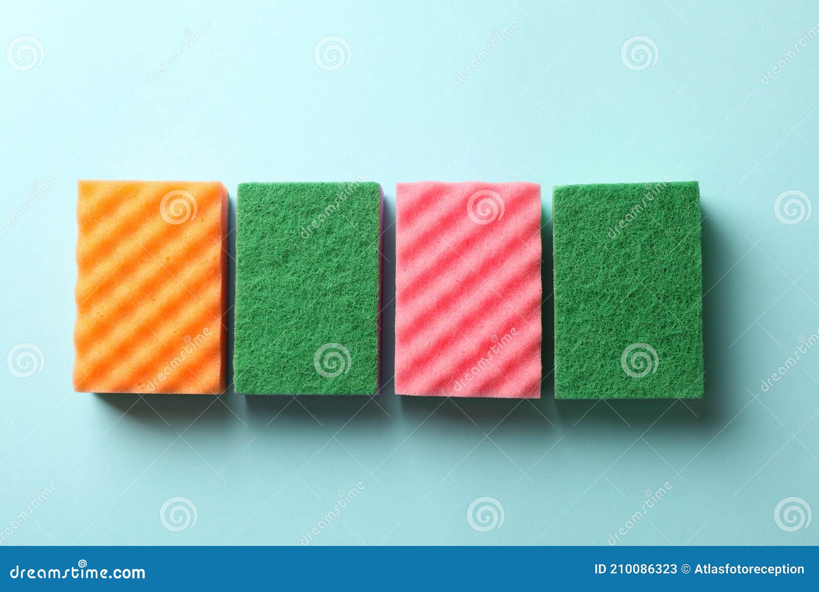 Color Sponges for Cleaning on Blue Background Stock Image - Image of ...