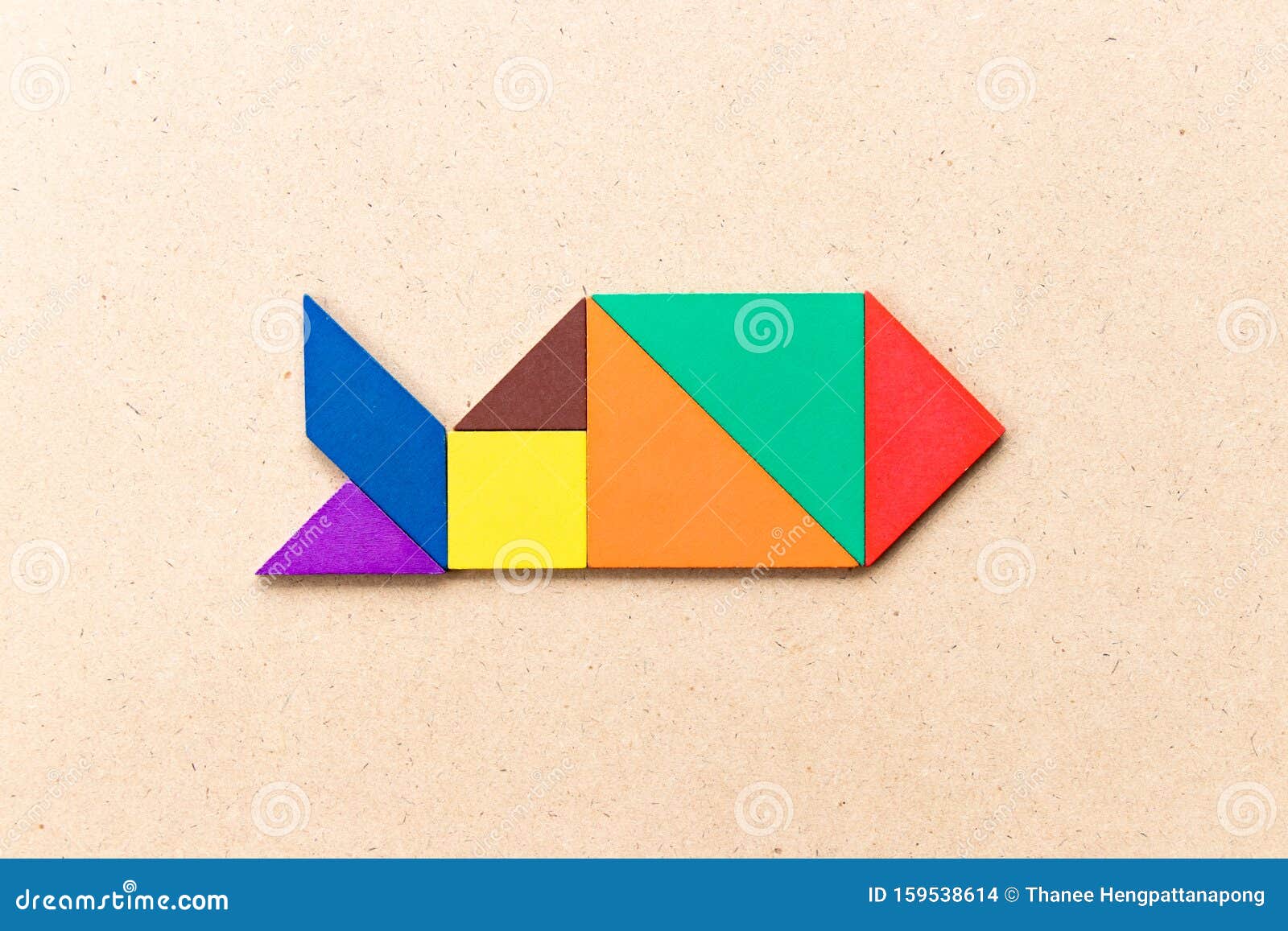 Color Tangram Puzzle in Fish Shape on Wood Background Stock Photo ...