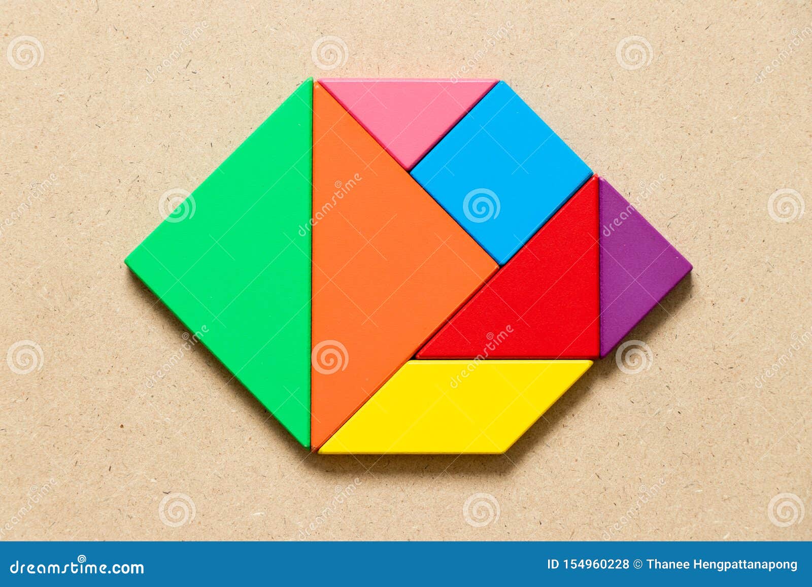 Color Tangram in Hexagon Shape on Wood Background Stock Photo - Image ...