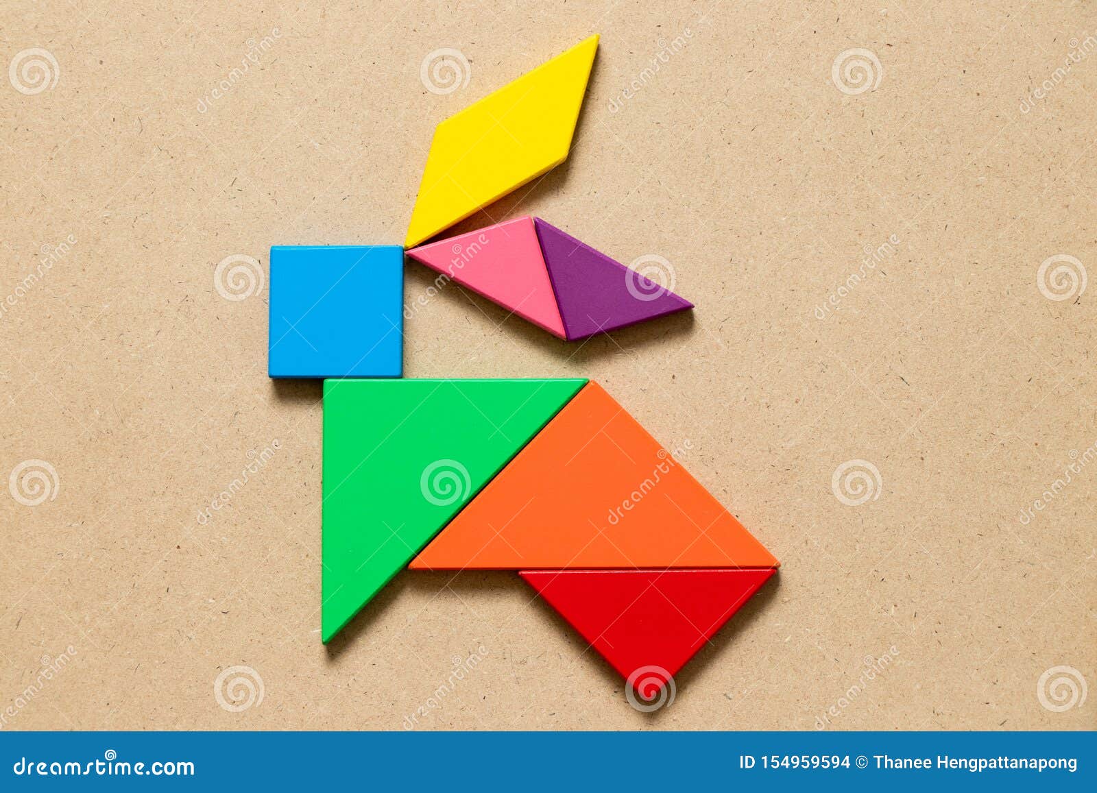 Color Tangram in Rabbit Shape on Wood Background Stock Photo - Image of ...