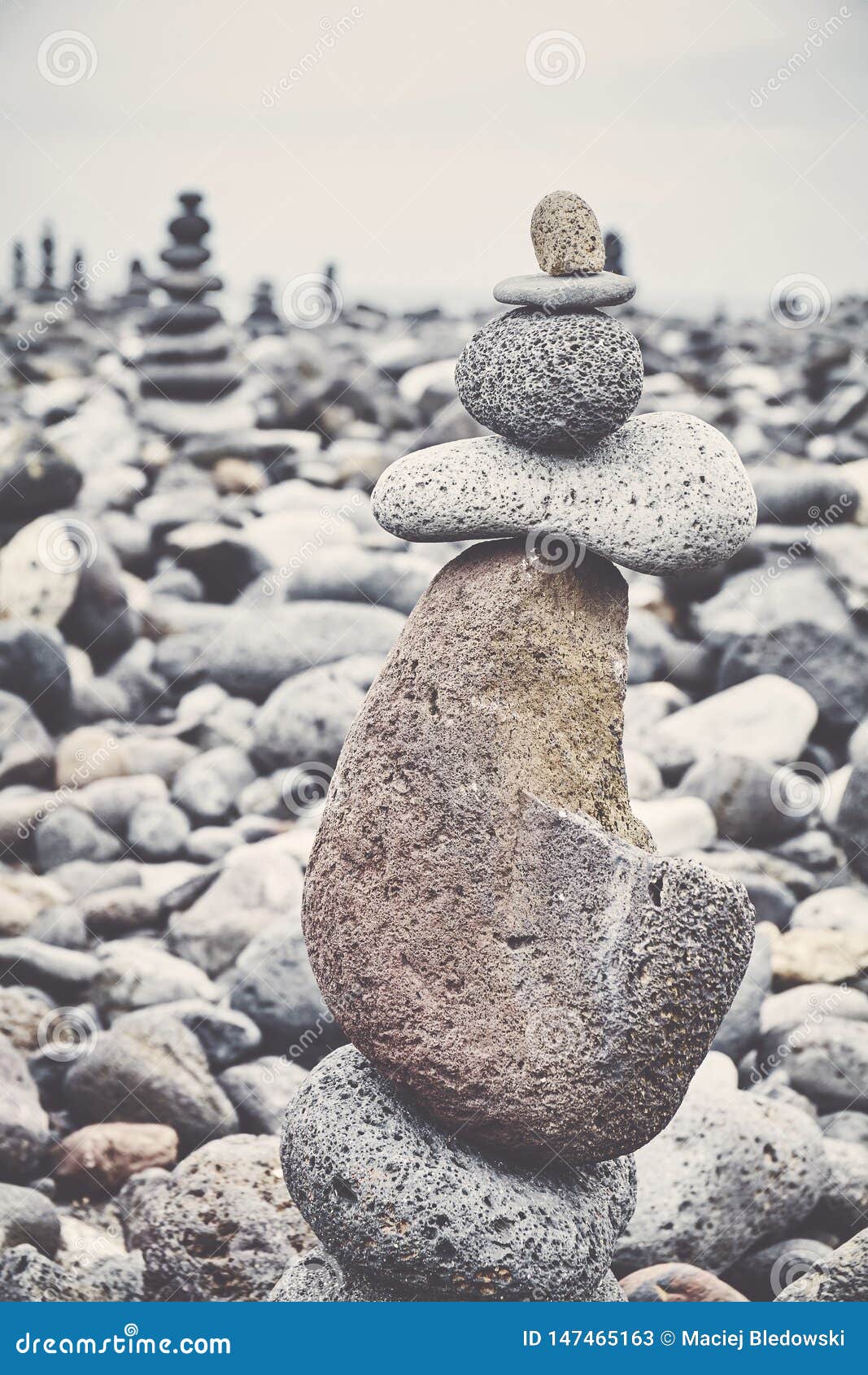 Color Toned Picture of a Volcanic Stones Stack on a Beach Stock Image ...