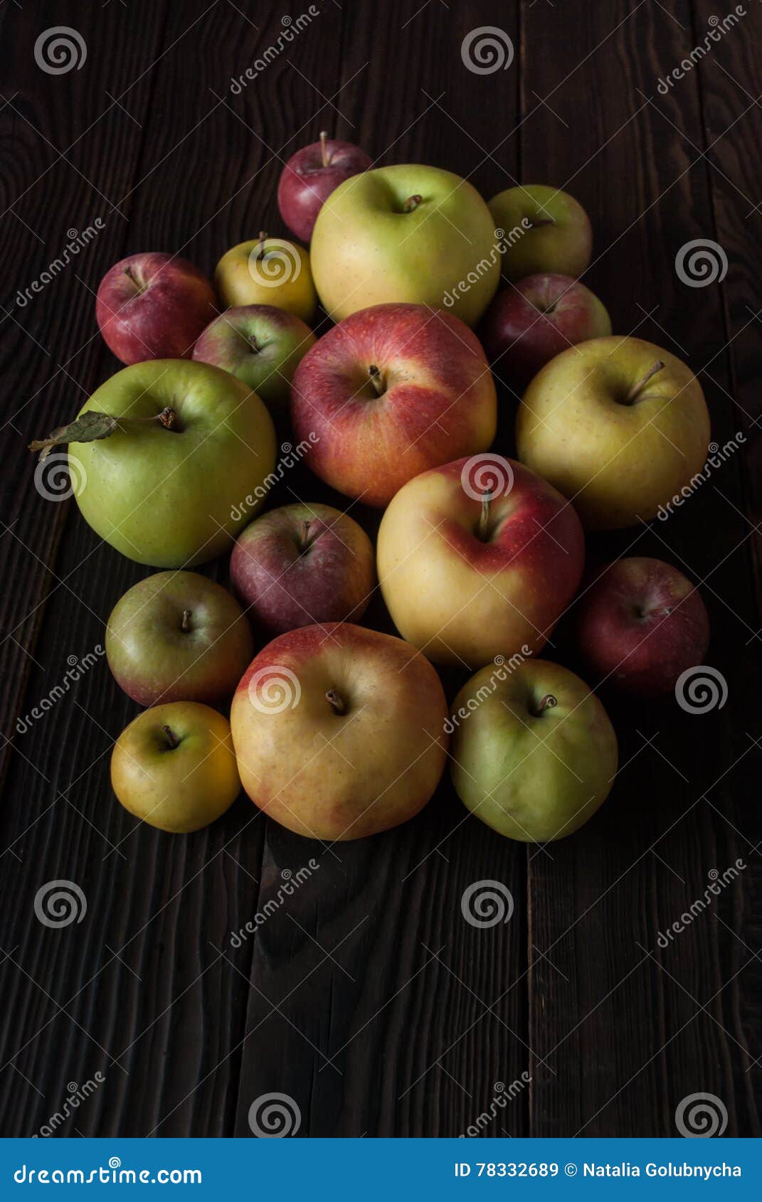 Colored Apples of Different Sizes on a Wooden Surface Stock Image ...