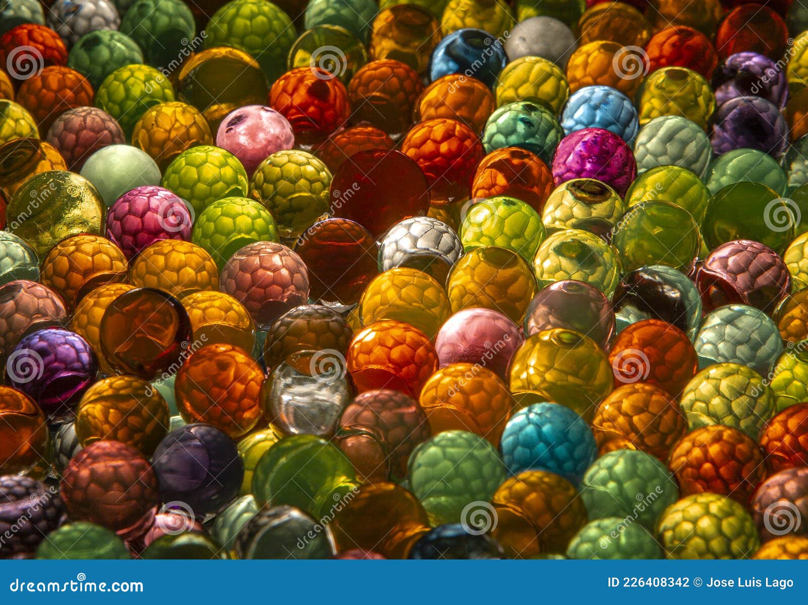 Colored Balls with Cell Shapes Inside and Illuminated that Give a ...