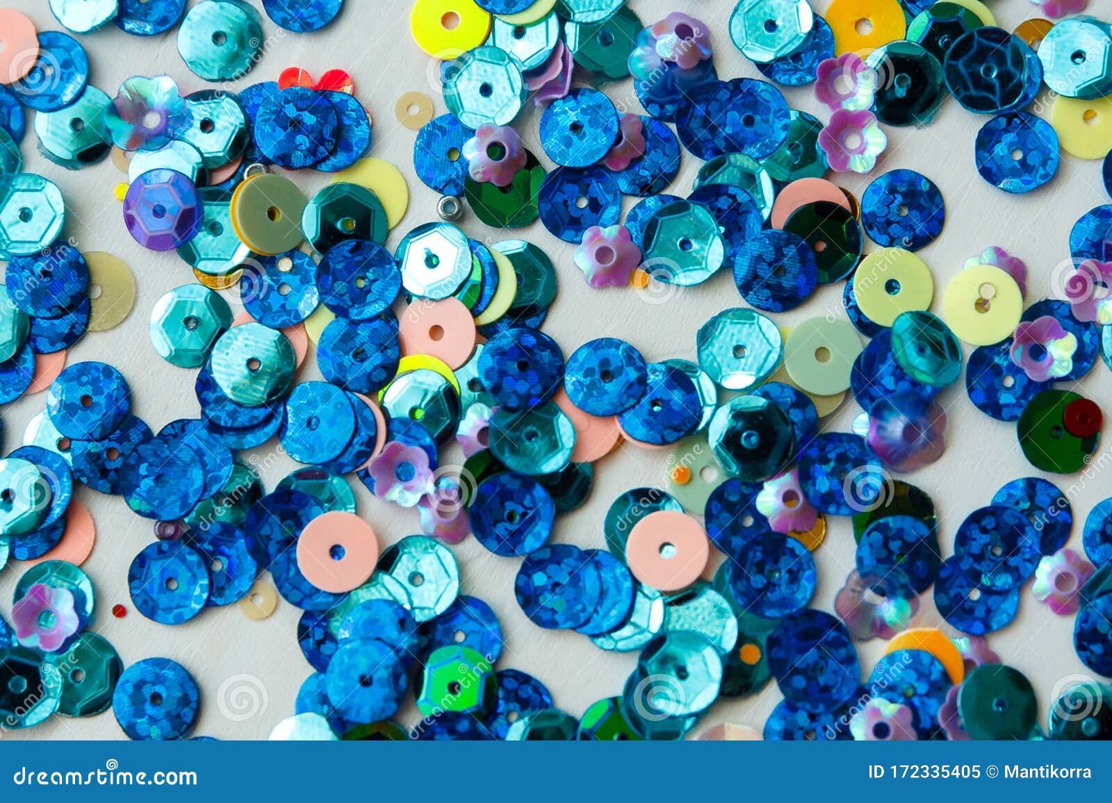 Colored and Blue Sequins on a White Background Stock Image - Image of ...