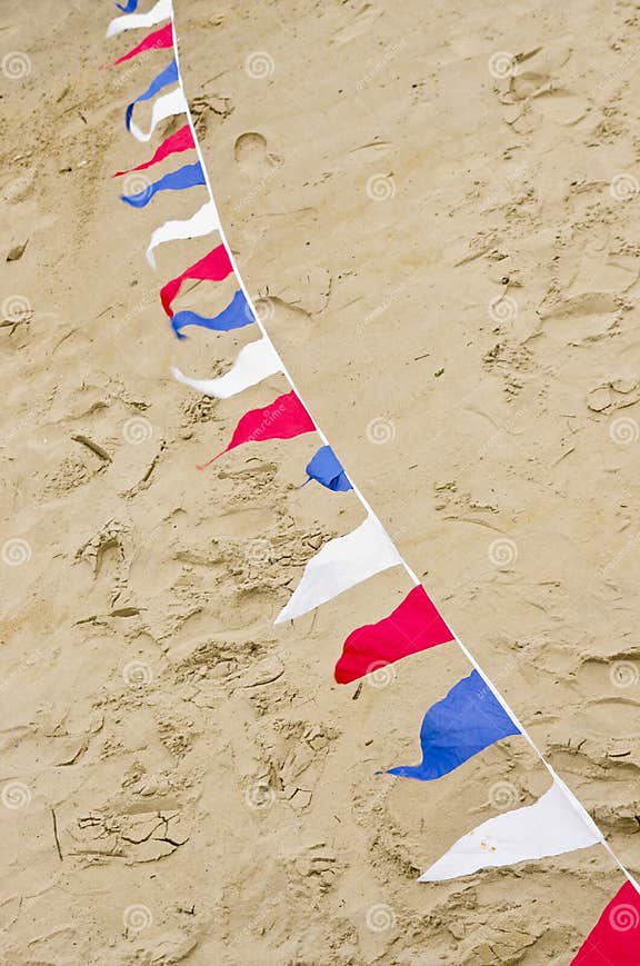 Colored Bunting Flags on Sand Surface Stock Image - Image of fabric ...