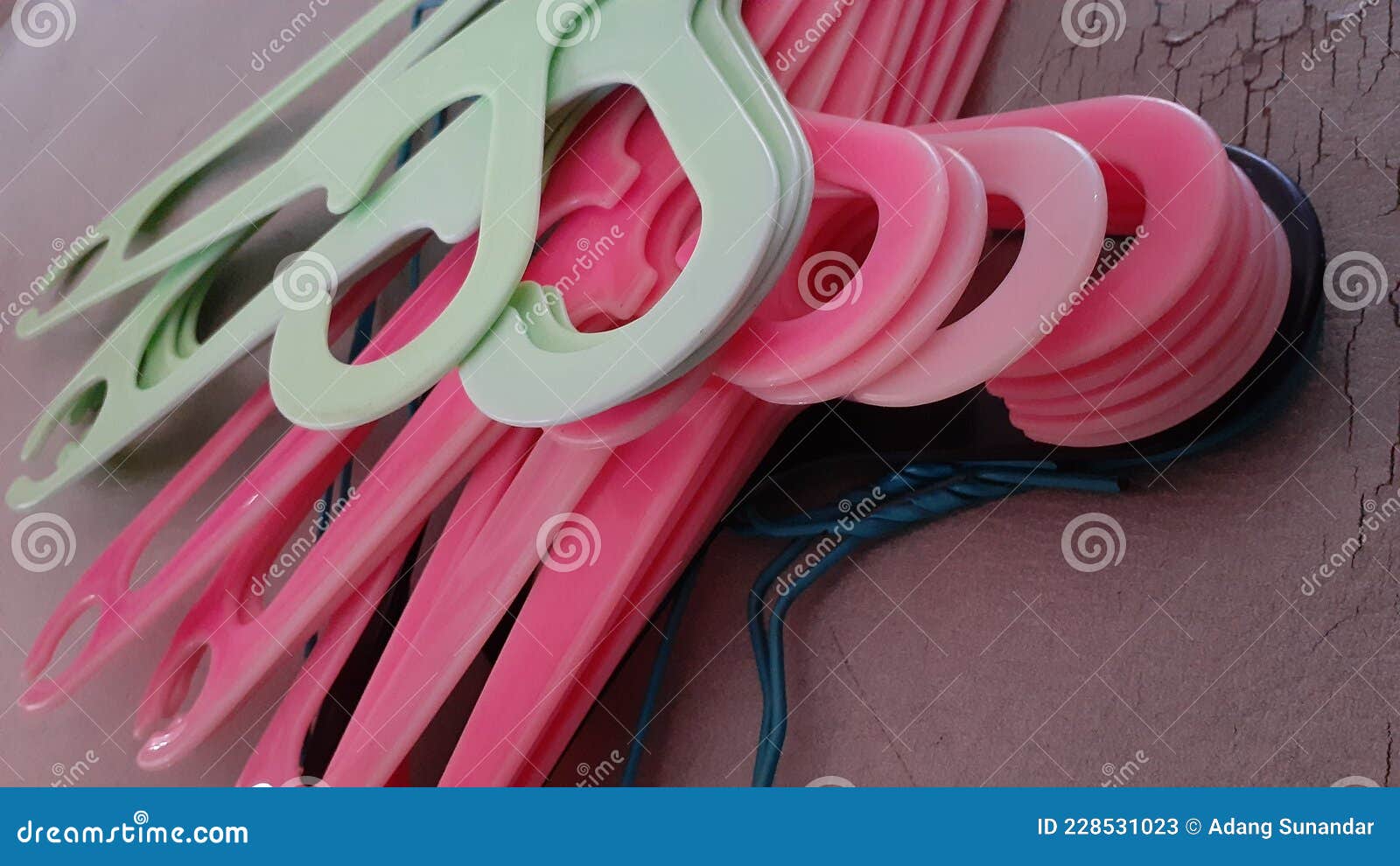 Colored coat hangers stock image. Image of hand, orange - 228531023
