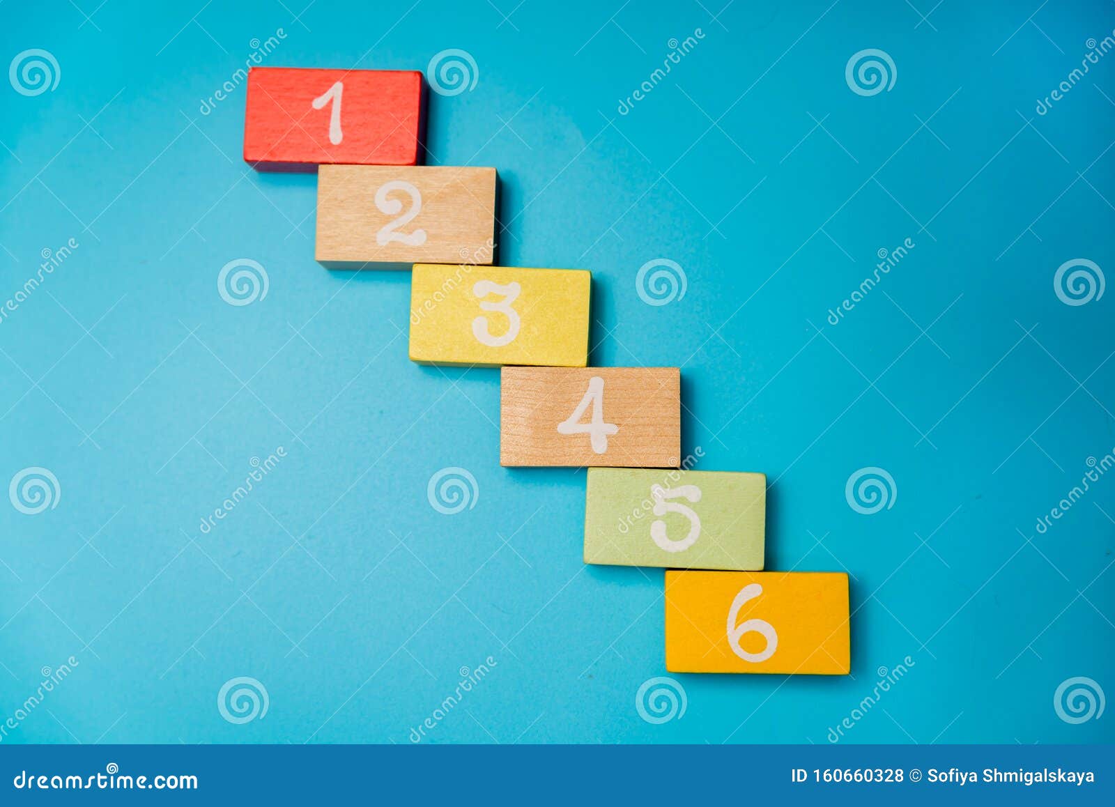 Colored Cubes with Numbers on a Blue Background Stock Photo - Image of ...