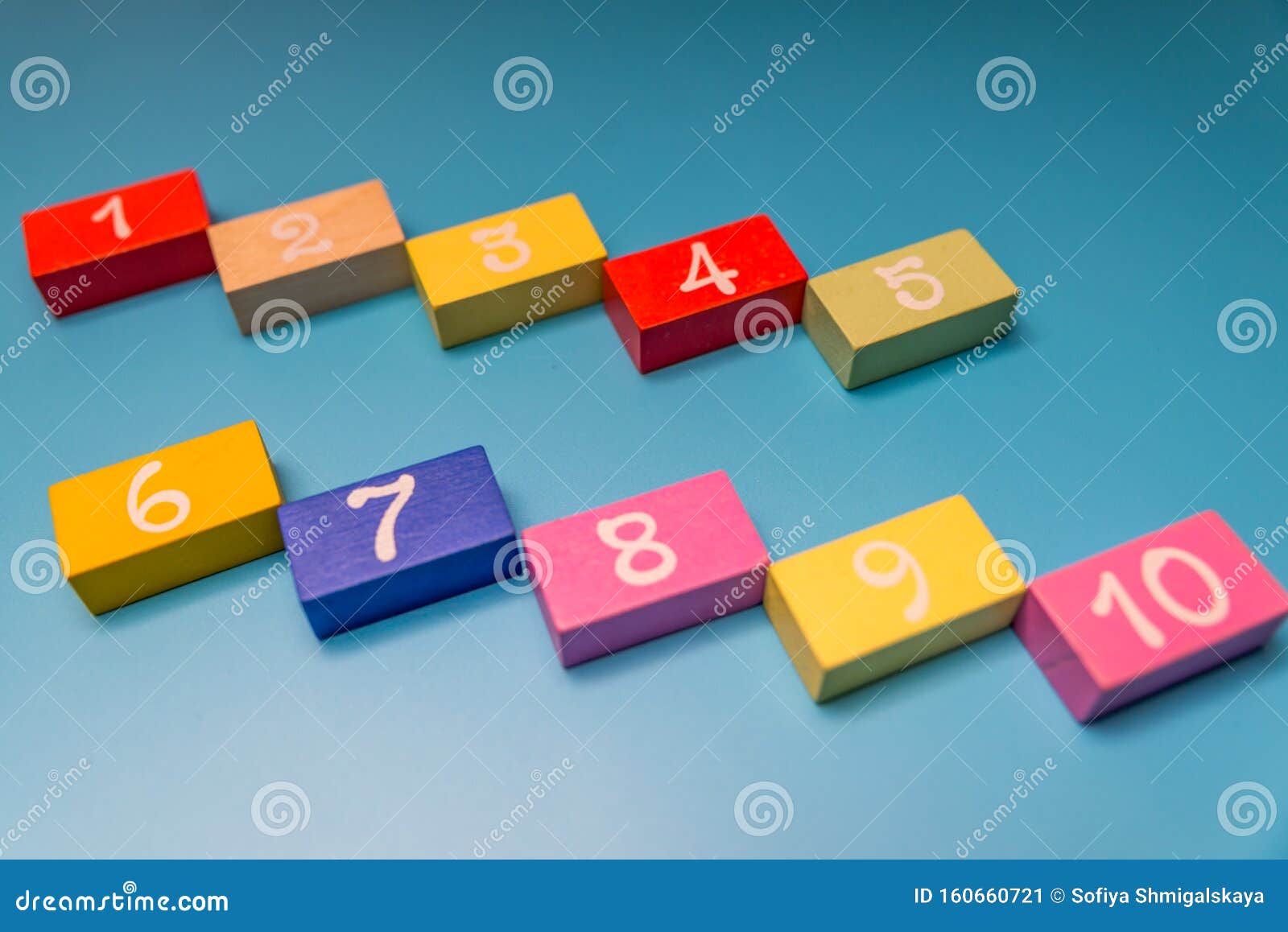 Colored Cubes with Numbers on a Blue Background Stock Image - Image of ...
