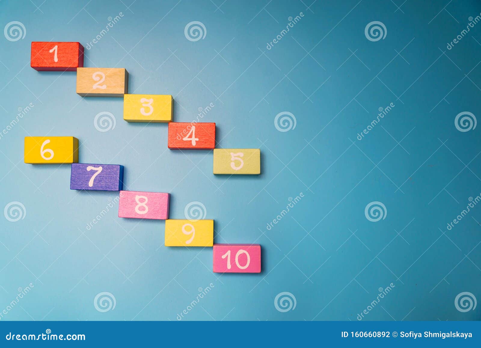 Colored Cubes with Numbers on a Blue Background Stock Photo - Image of ...