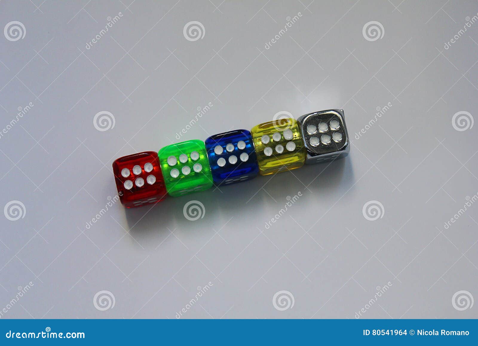 Colored dice on the desk stock photo. Image of colored - 80541964