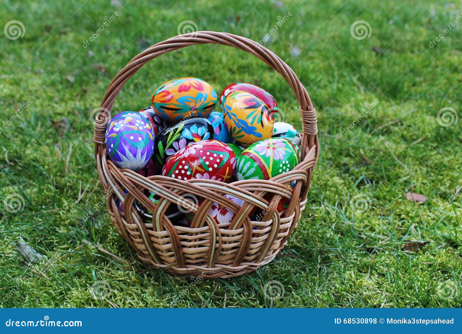 Colored Easter Eggs in Basket Stock Photo - Image of holiday, wicker ...