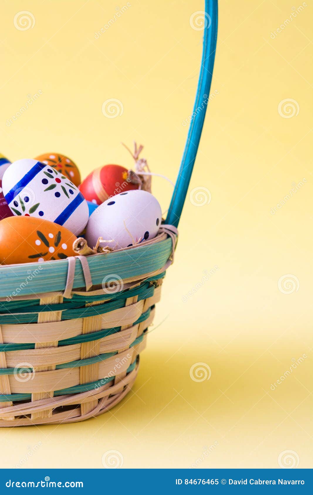 Colored Easter Eggs in a Basket Stock Image - Image of flowers, colored ...