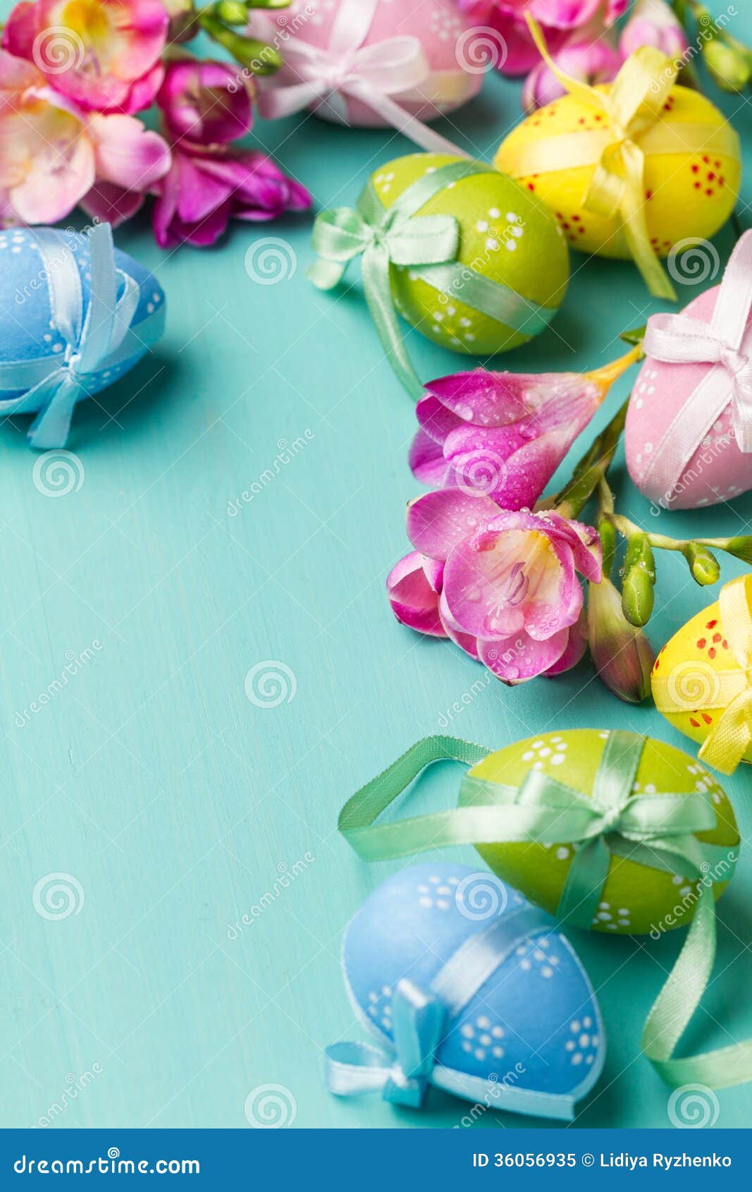 Colored Easter Eggs and Flowers on a Turquoise Table Stock Image ...