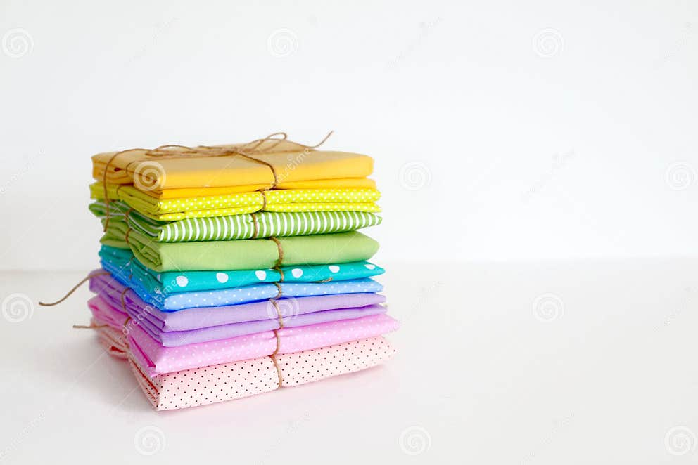 Colored Fabric Folded Stack. Needle Bed, Scissors, Measuring Tap Stock ...