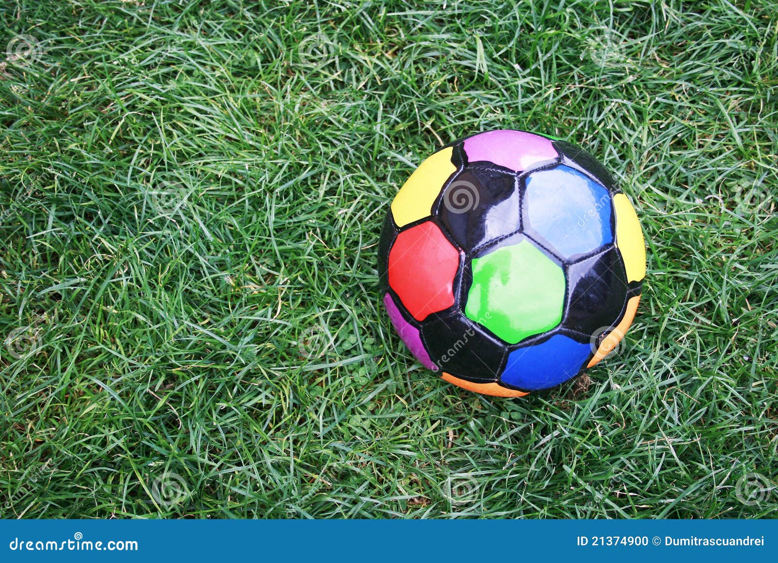Colored football in grass stock photo. Image of sokker - 21374900