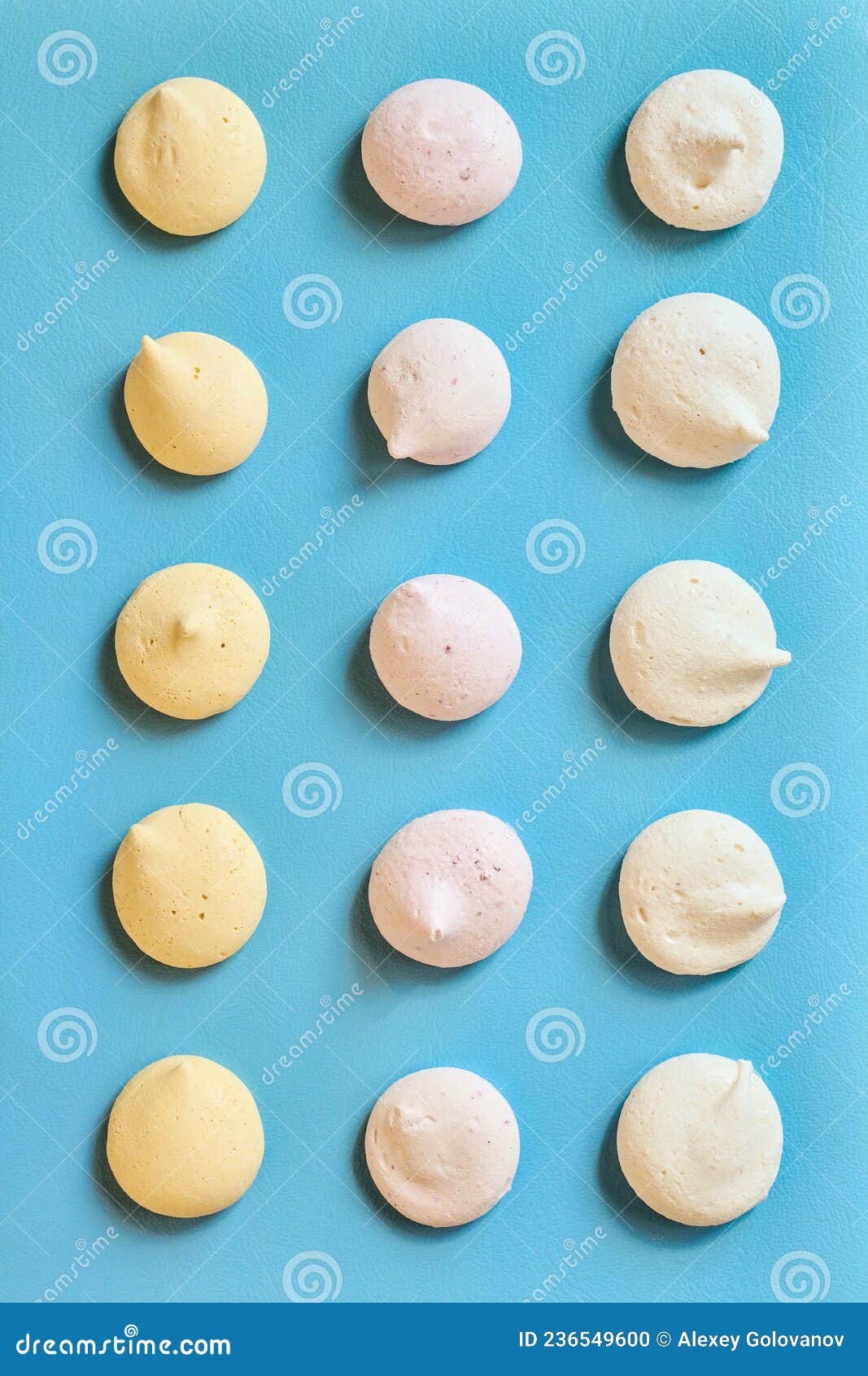 Colored Fruit Meringues Lying in Rows on a Blue Background Stock Photo ...