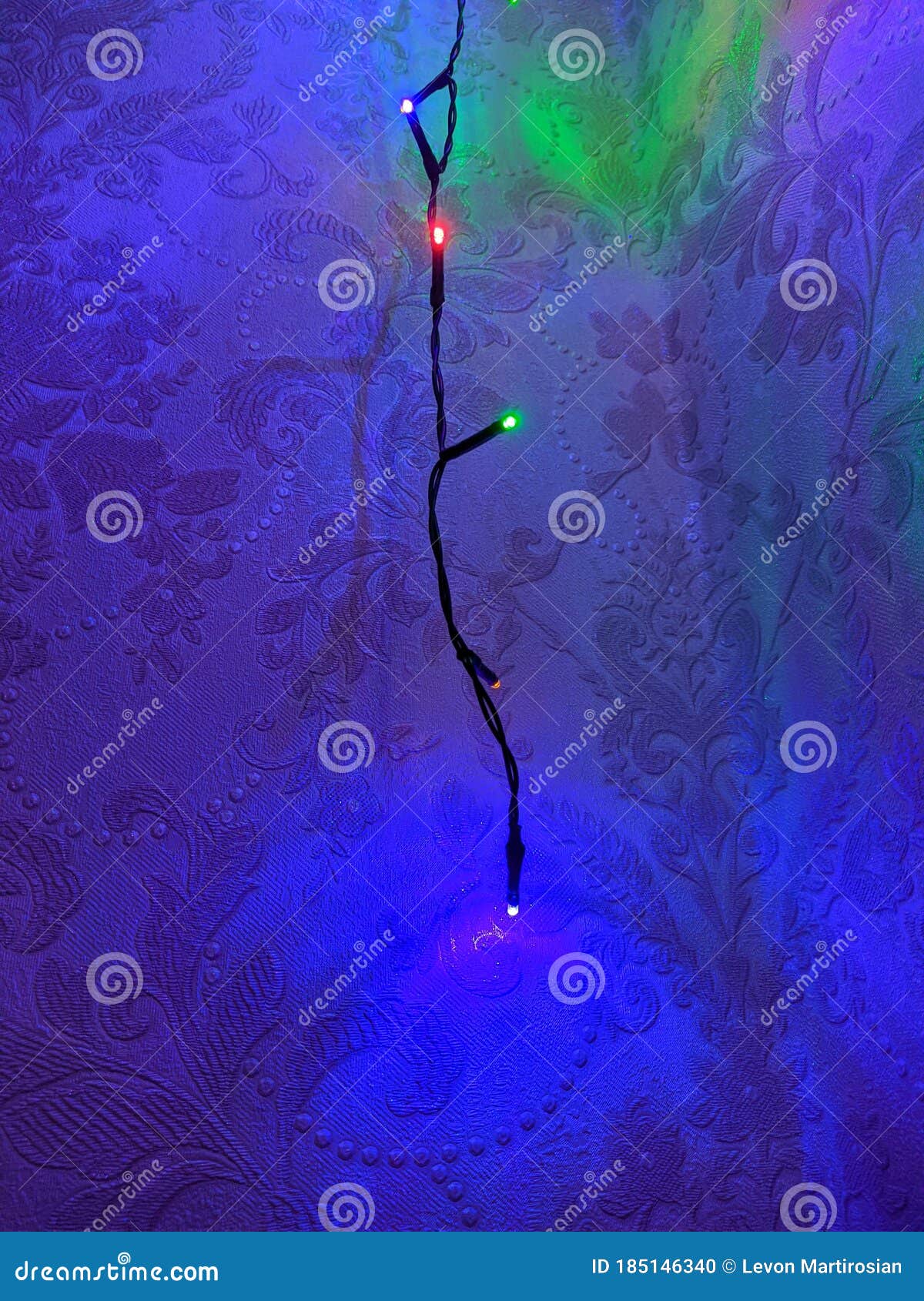 Colored Garland Shines in Different Colors and is Reflected from the ...