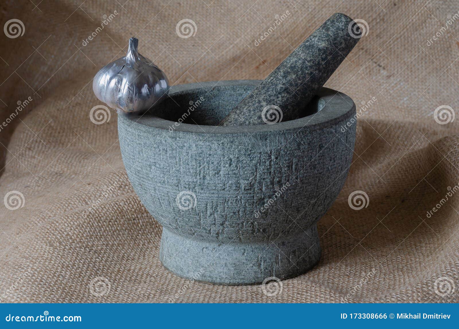 Stone Mortar with a Silver Head of Garlic Stock Photo - Image of ...