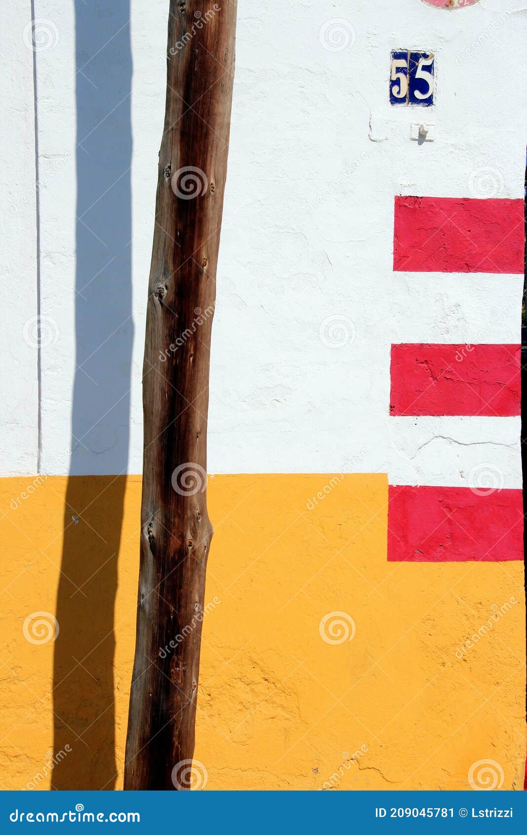 Colored Geometric Elements on the Wall with the Wooden Pole and Its ...