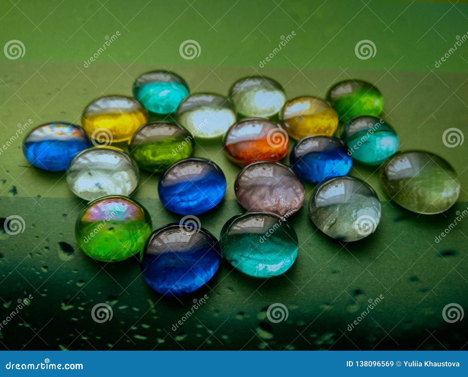 Colored Glass Hemispheres on a Green Background Stock Image - Image of ...