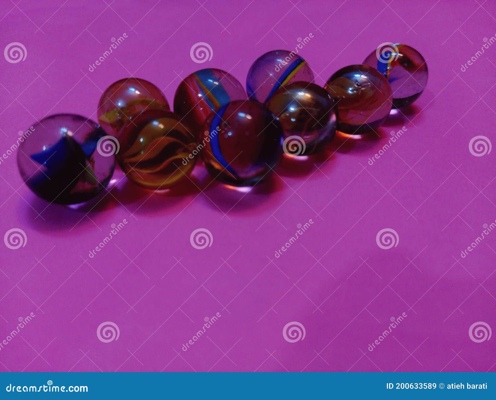 Colored glass marbles stock image. Image of dark, bead - 200633589