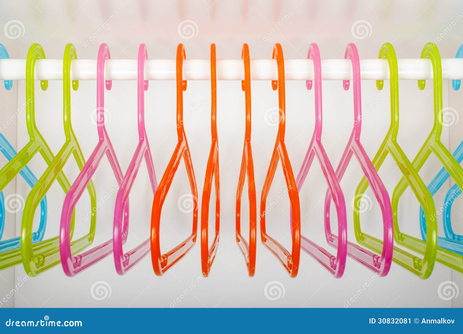 Colored Hangers on a Rod in a Wardrobe Stock Image - Image of fashion ...