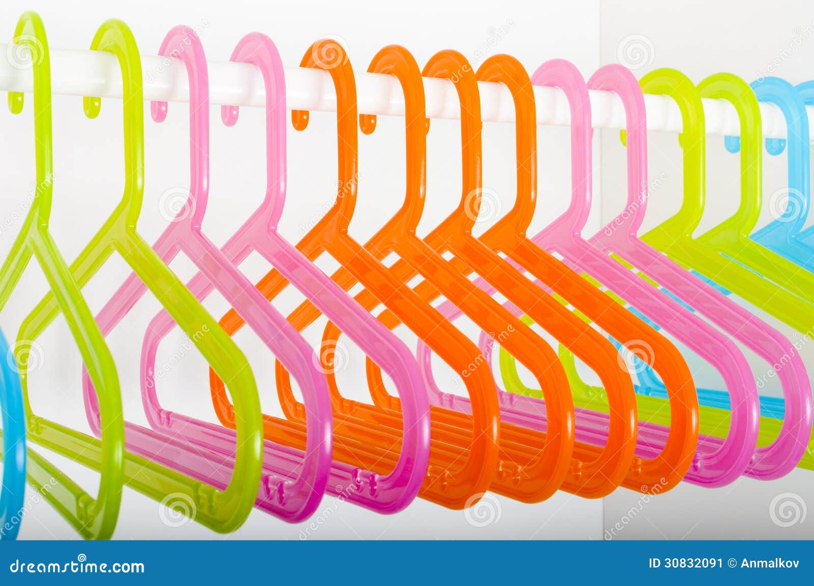 Colored Hangers on a Rod in a Wardrobe Stock Image - Image of storage ...