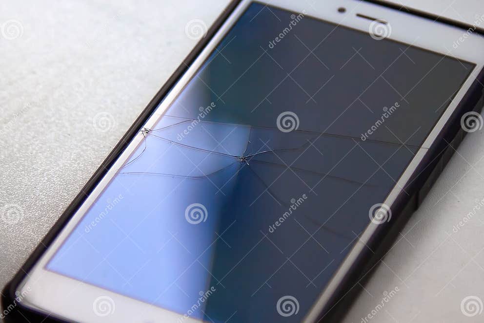 Colored Highlights of a Broken Mobile Phone Screen in the Reflection of ...