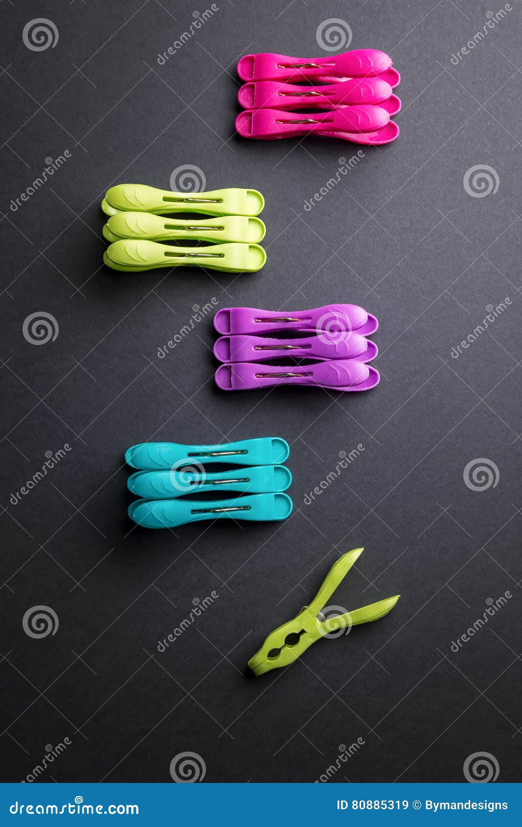 Colored Laundry Clips Over a Black Background Above View Stock Image ...