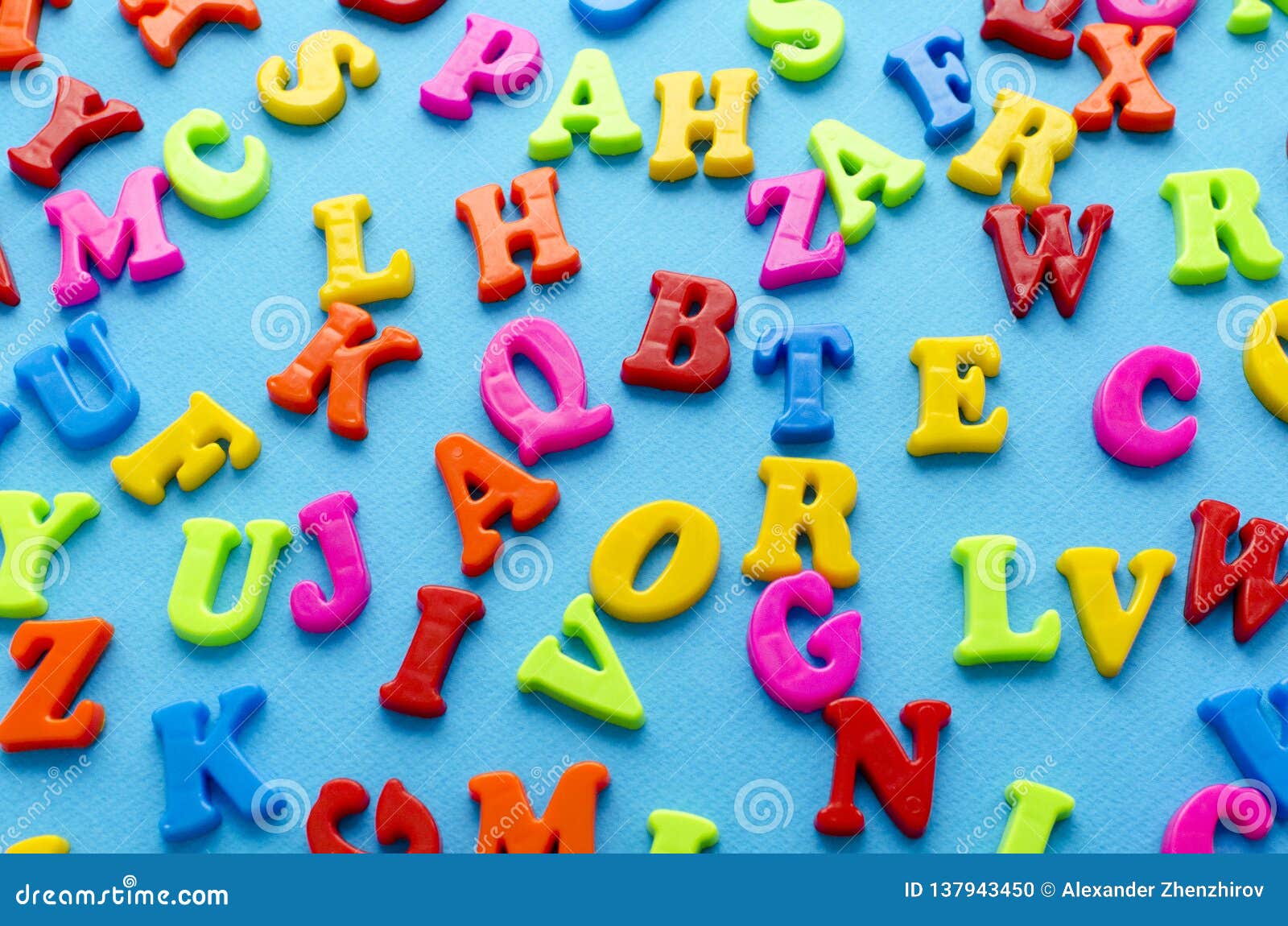 Colored Letters on Blue Background Stock Photo - Image of colorful ...