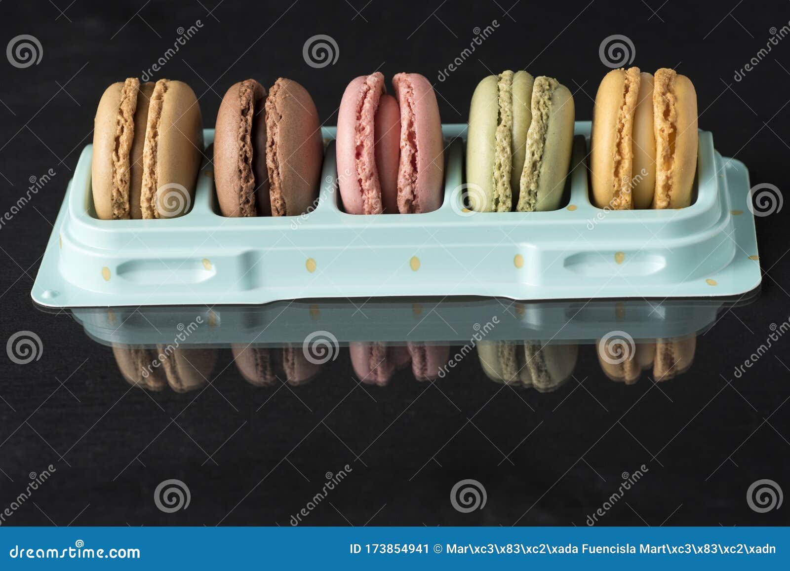 Colored Macarons on a Black Surface and with Stock Image - Image of ...