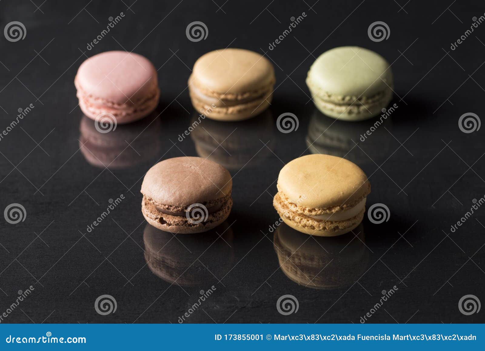 Colored Macarons on a Black Surface and with Stock Image - Image of ...