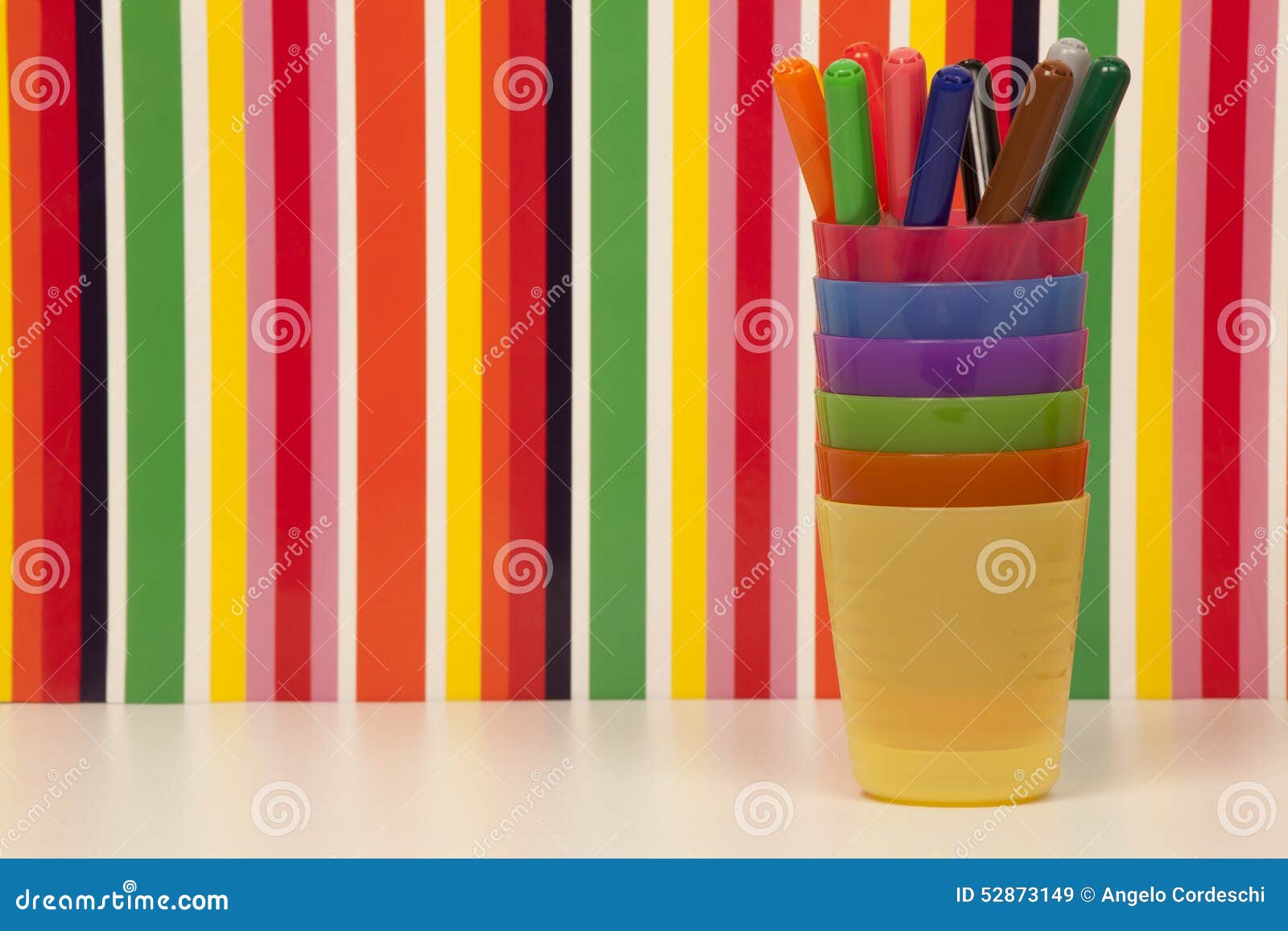 Colored Markers, Plastic Cups Stacked and Multicolored Stripes ...