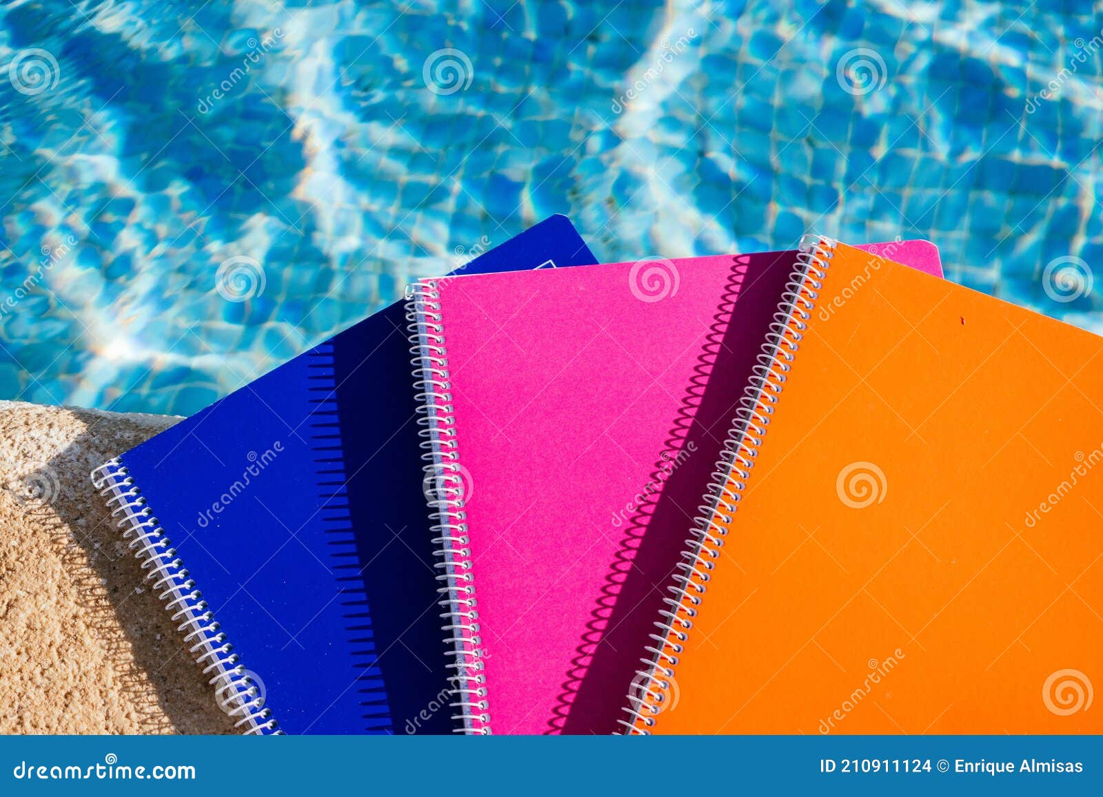 Colored Notebooks Next To a Pool Stock Photo - Image of information ...