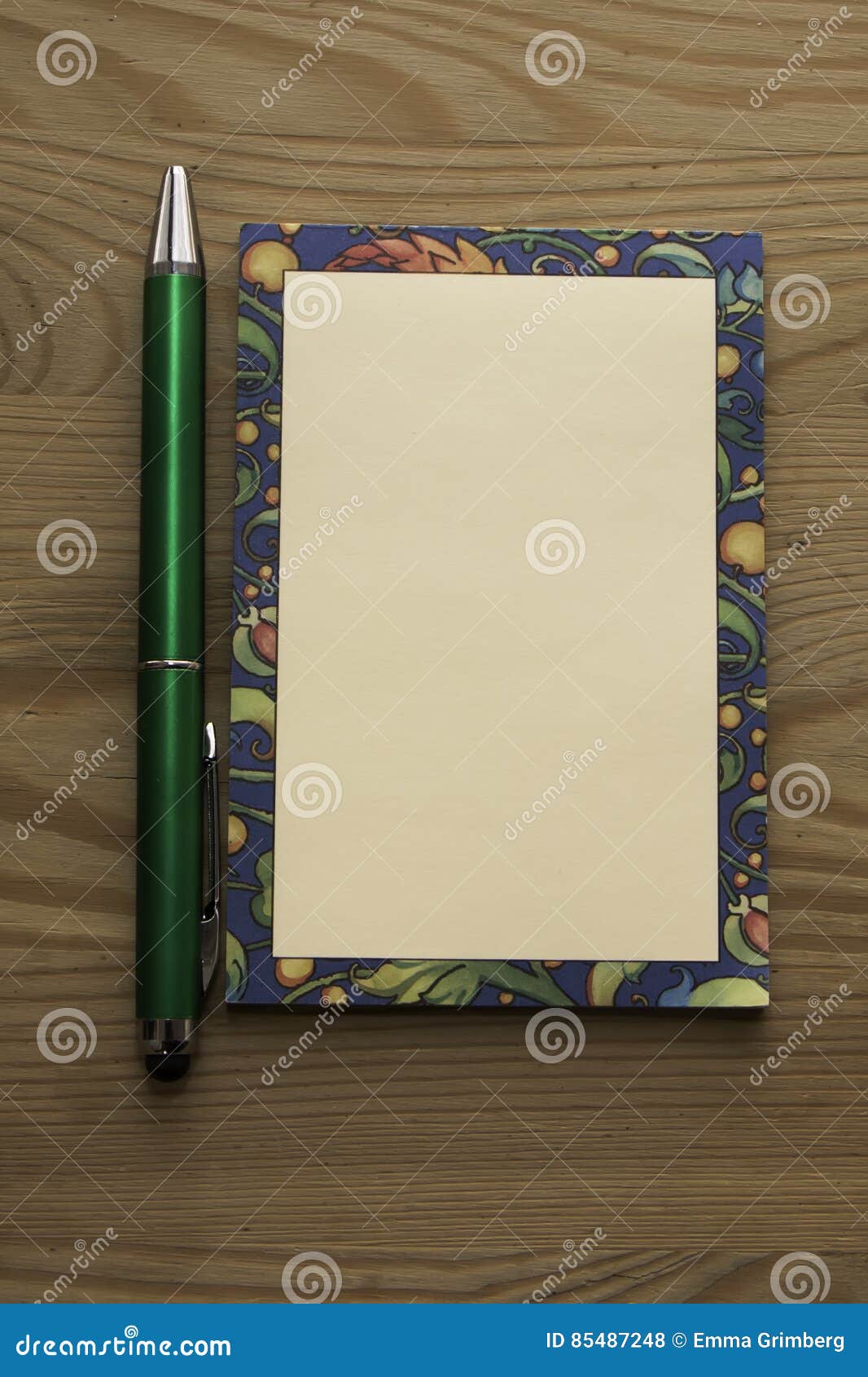 Colored Notepad and a Green Pen on a Wooden Background Stock Photo ...