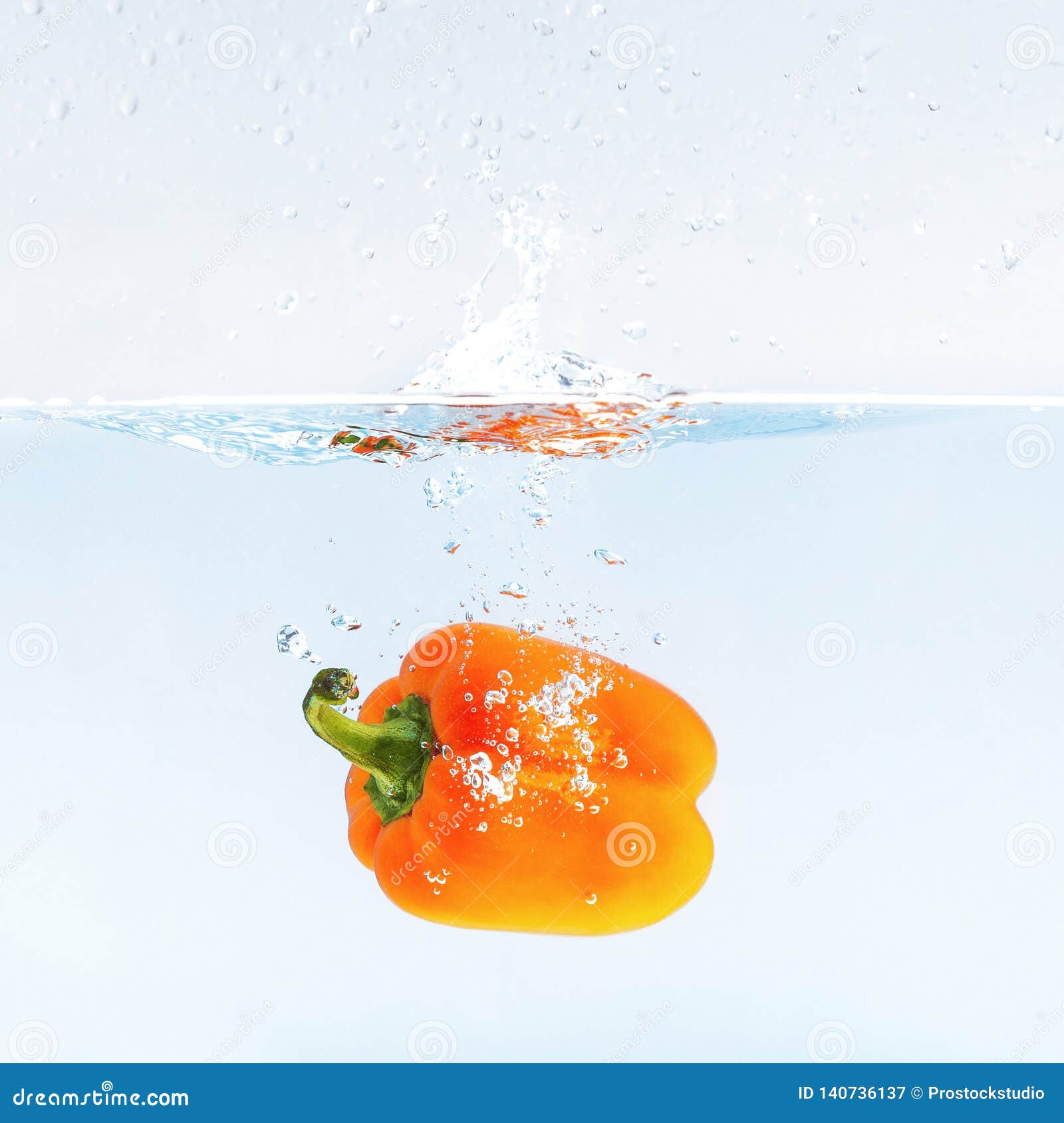 Colored Orange Paprika in Water Splashes on Blue Background Stock Image ...
