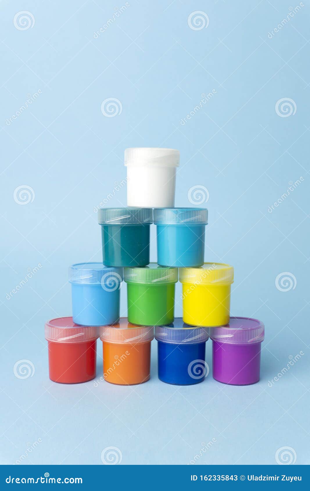 Colored Paints on a Clear Blue Background. Bright Color Paints for ...