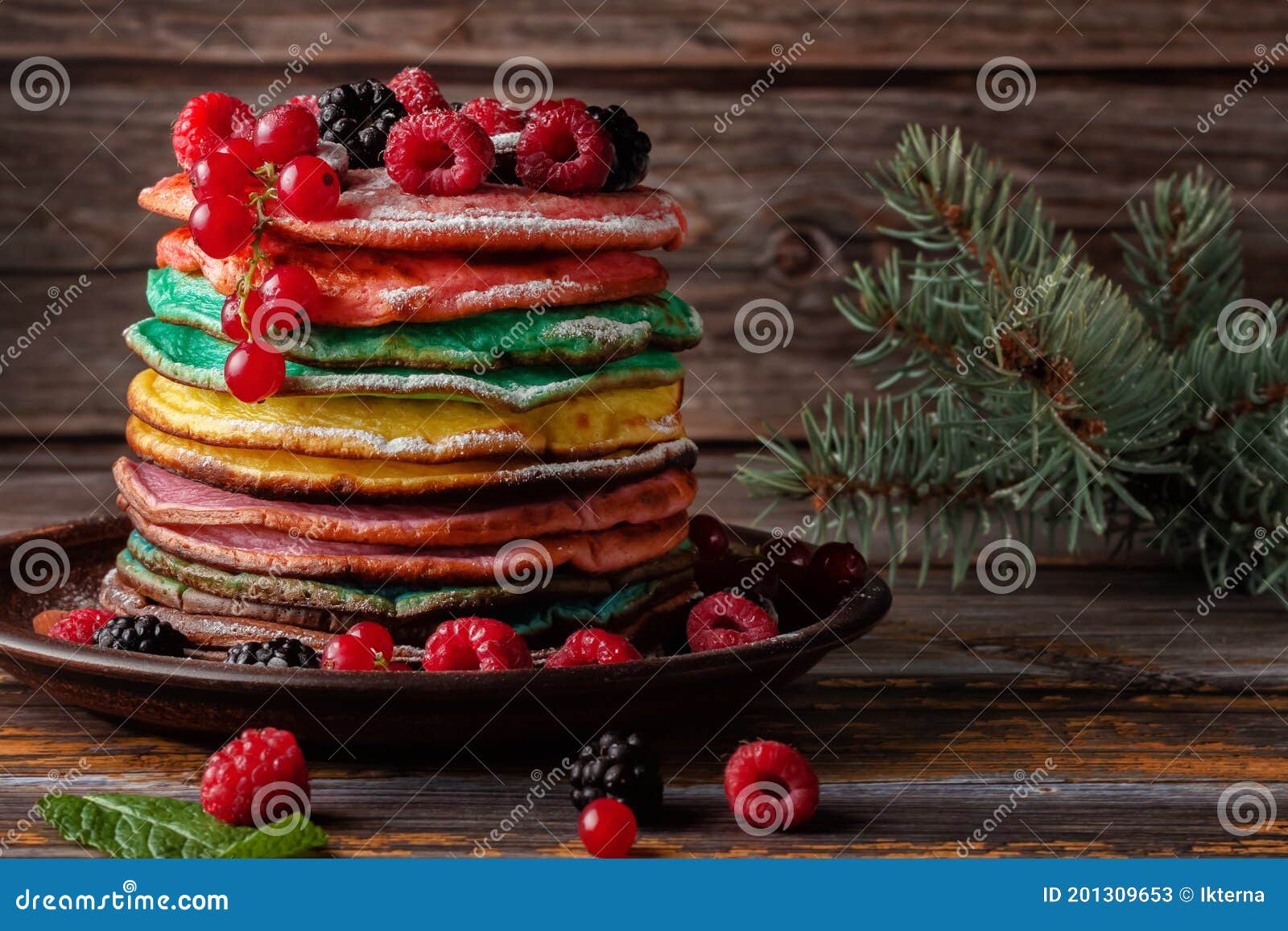 Colored Pancakes with Fruit, Almonds and Powdered Sugar. Stock Image ...