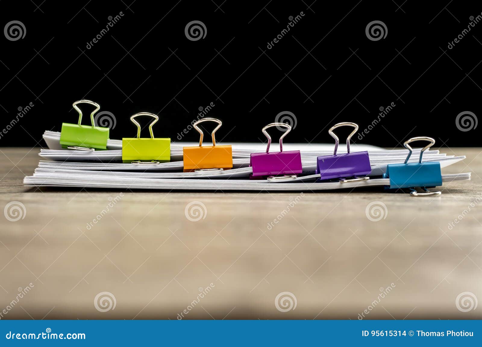 Colored Paper Binders on Banch of Paperwork Stock Photo - Image of book ...