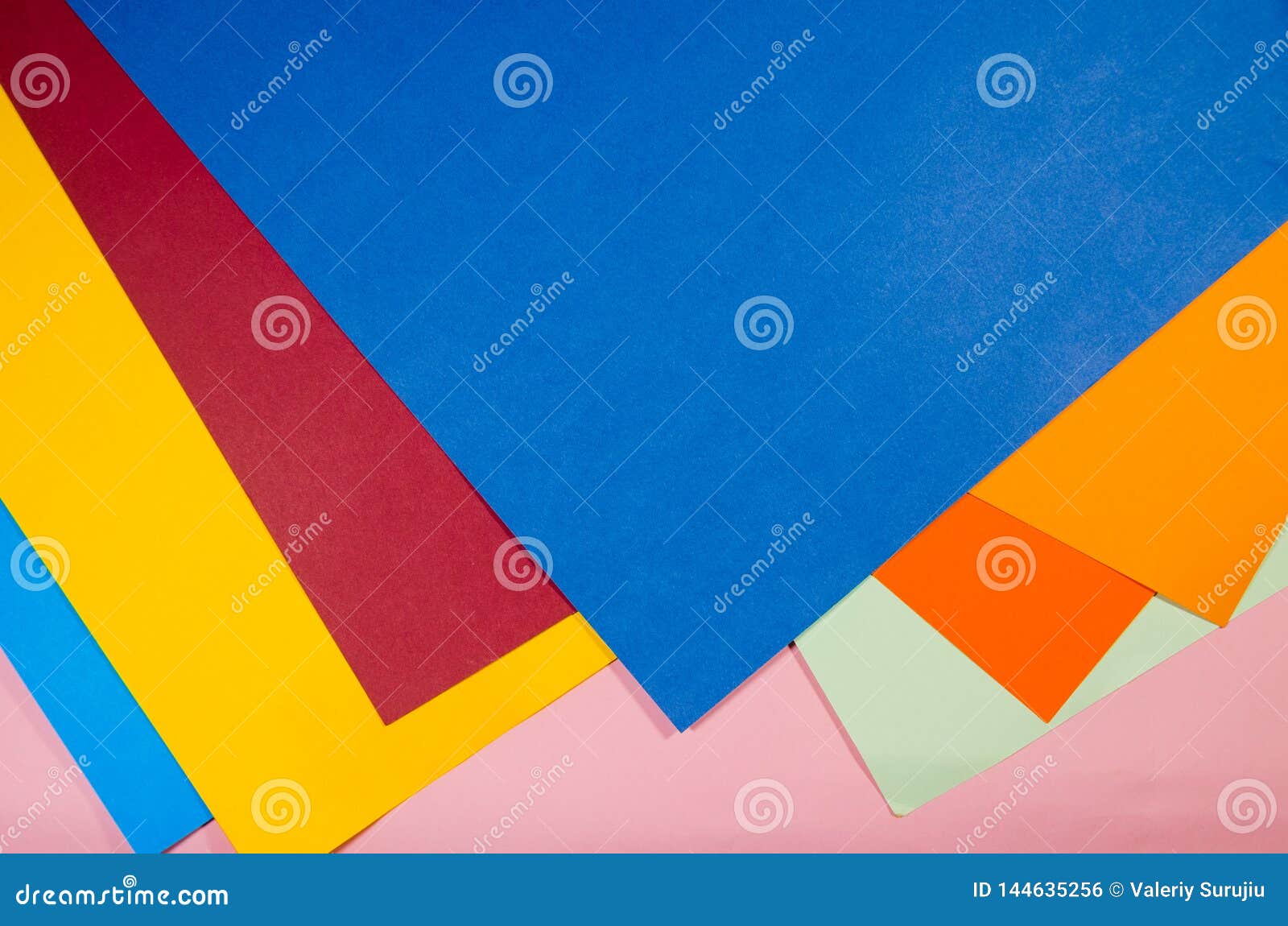Colored papers in a pile stock photo. Image of abstract - 144635256