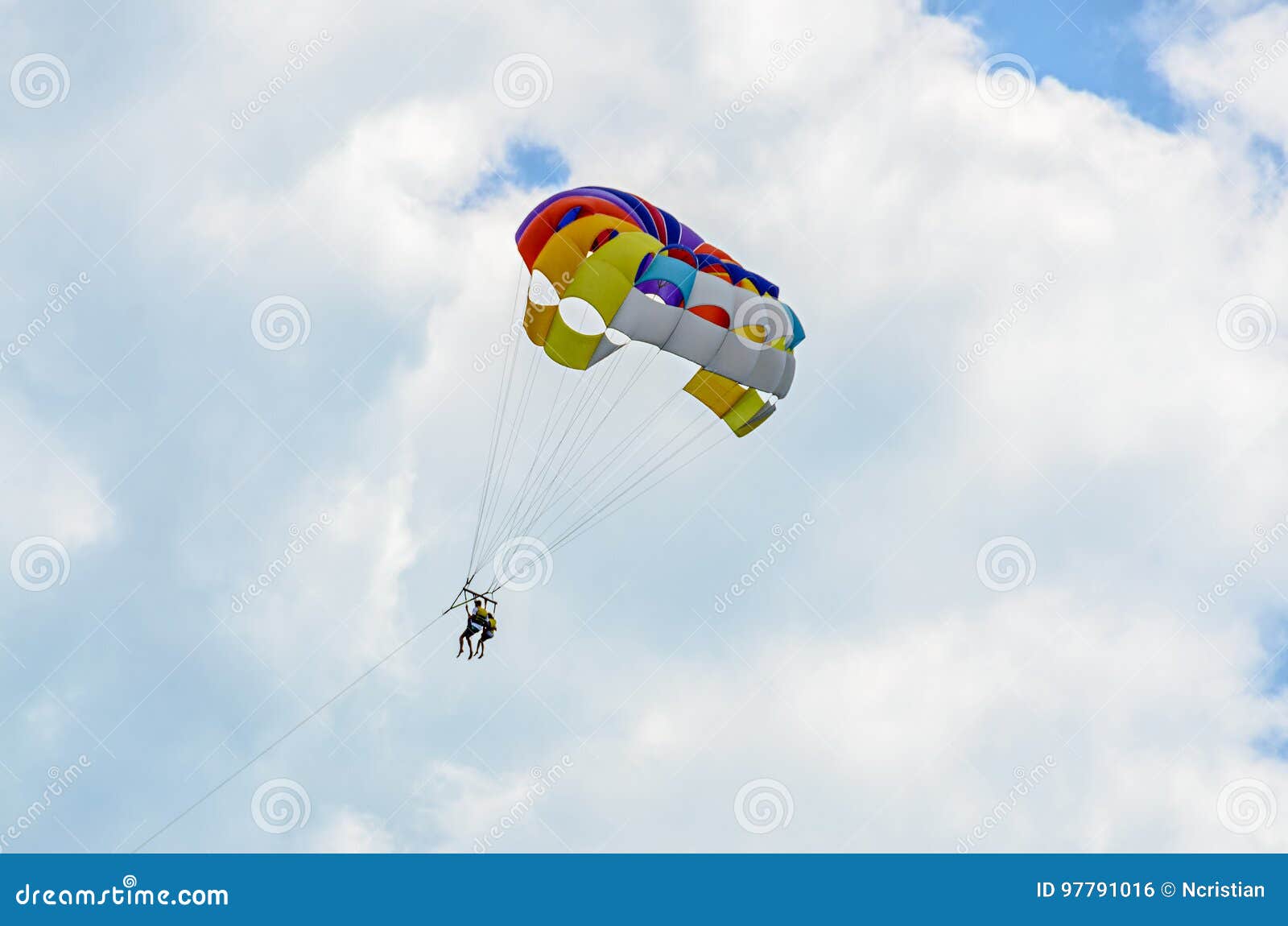 Colored Parasail Wing in the Blue Clouds Sky, Parasailing Stock Photo ...