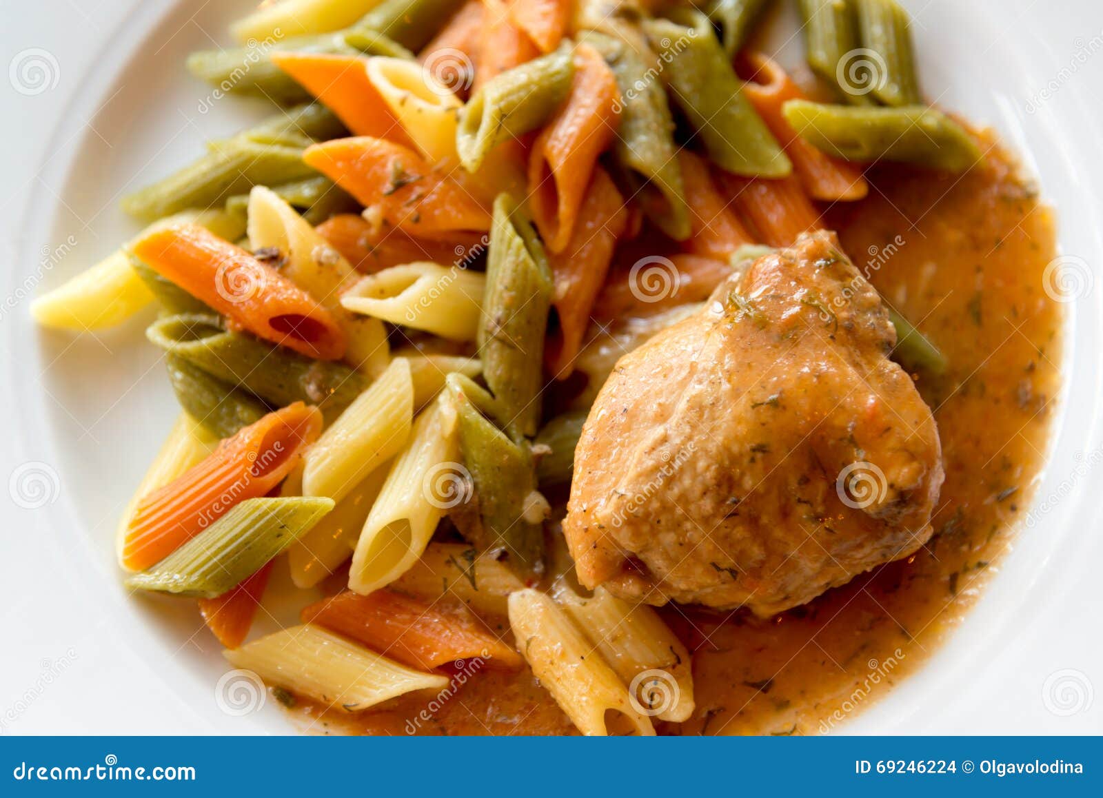 Colored Pasta with Chicken on Plate Stock Photo - Image of chicken ...